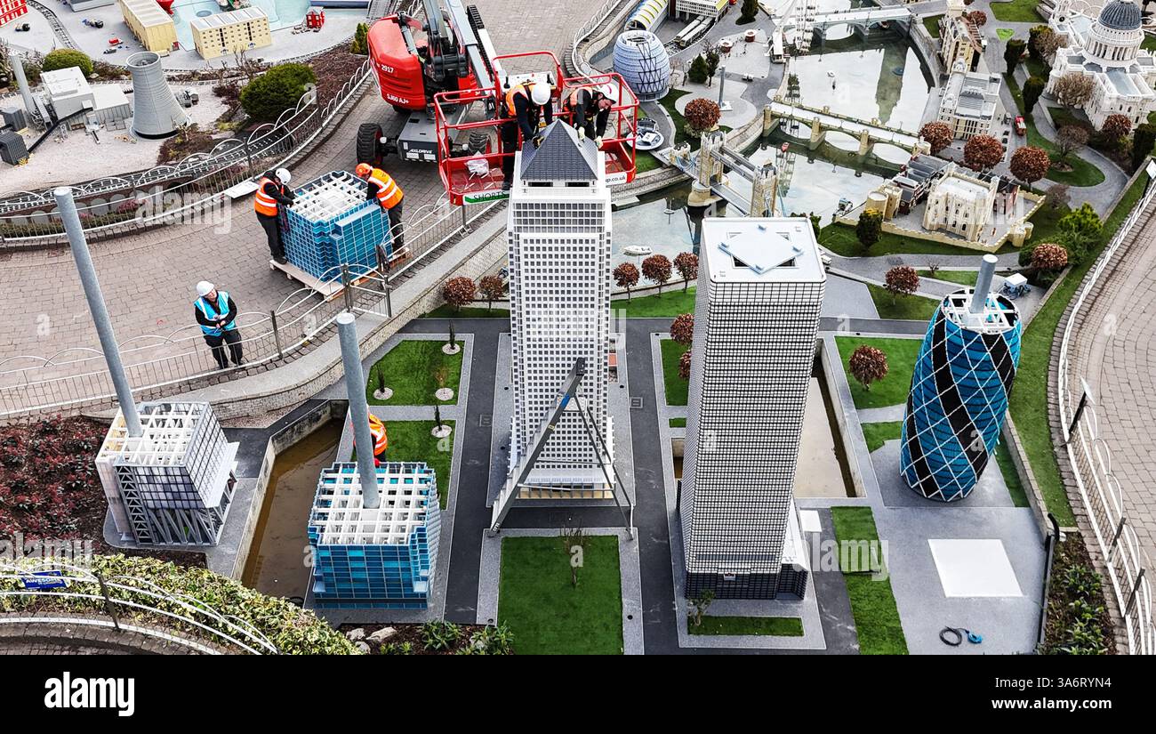 Model makers assemble a replica of One Canada Square as part of their ...
