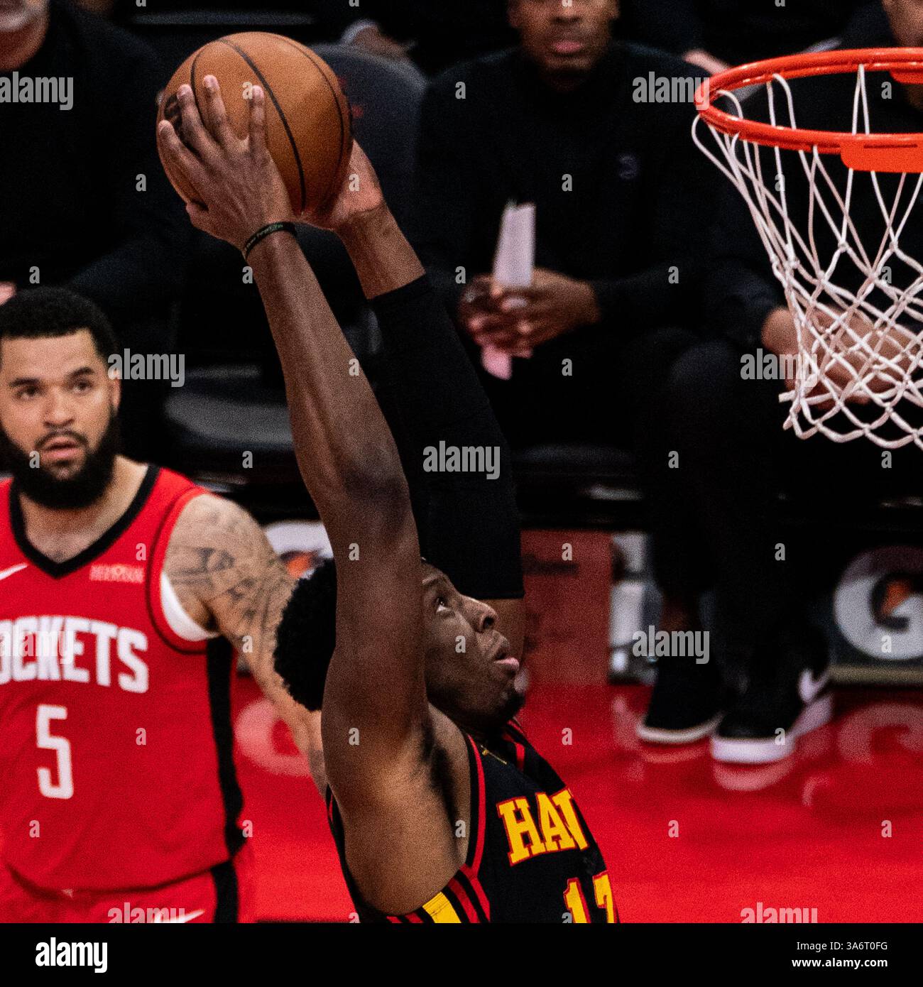 Houston, USA. 25th Mar, 2025. Onyeka Okongwu of Atlanta Hawks dunks ...