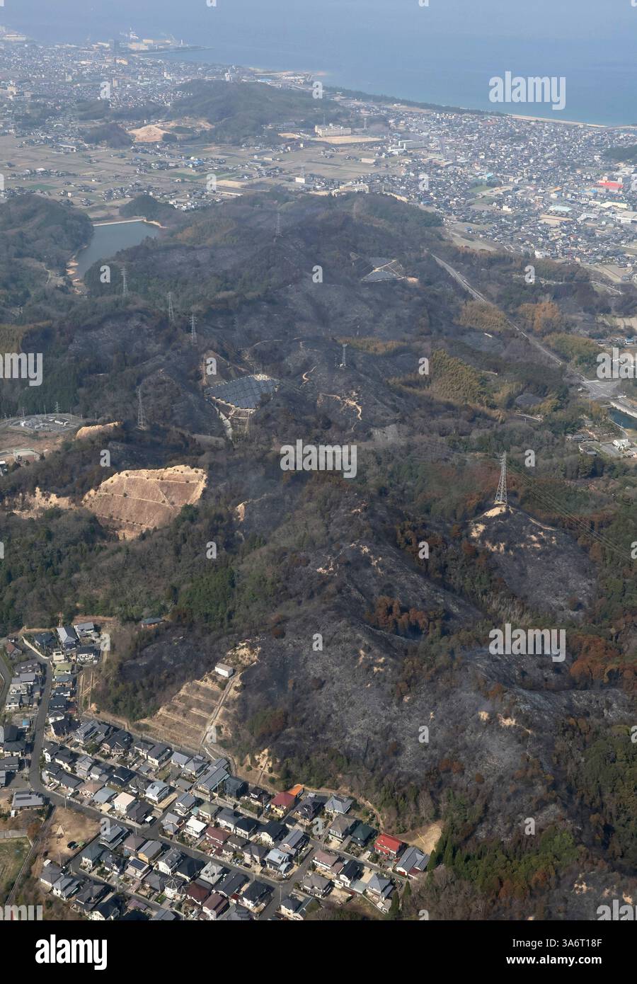 Aerial photo shows burnt mountain forest due to forest fire in Imabari ...