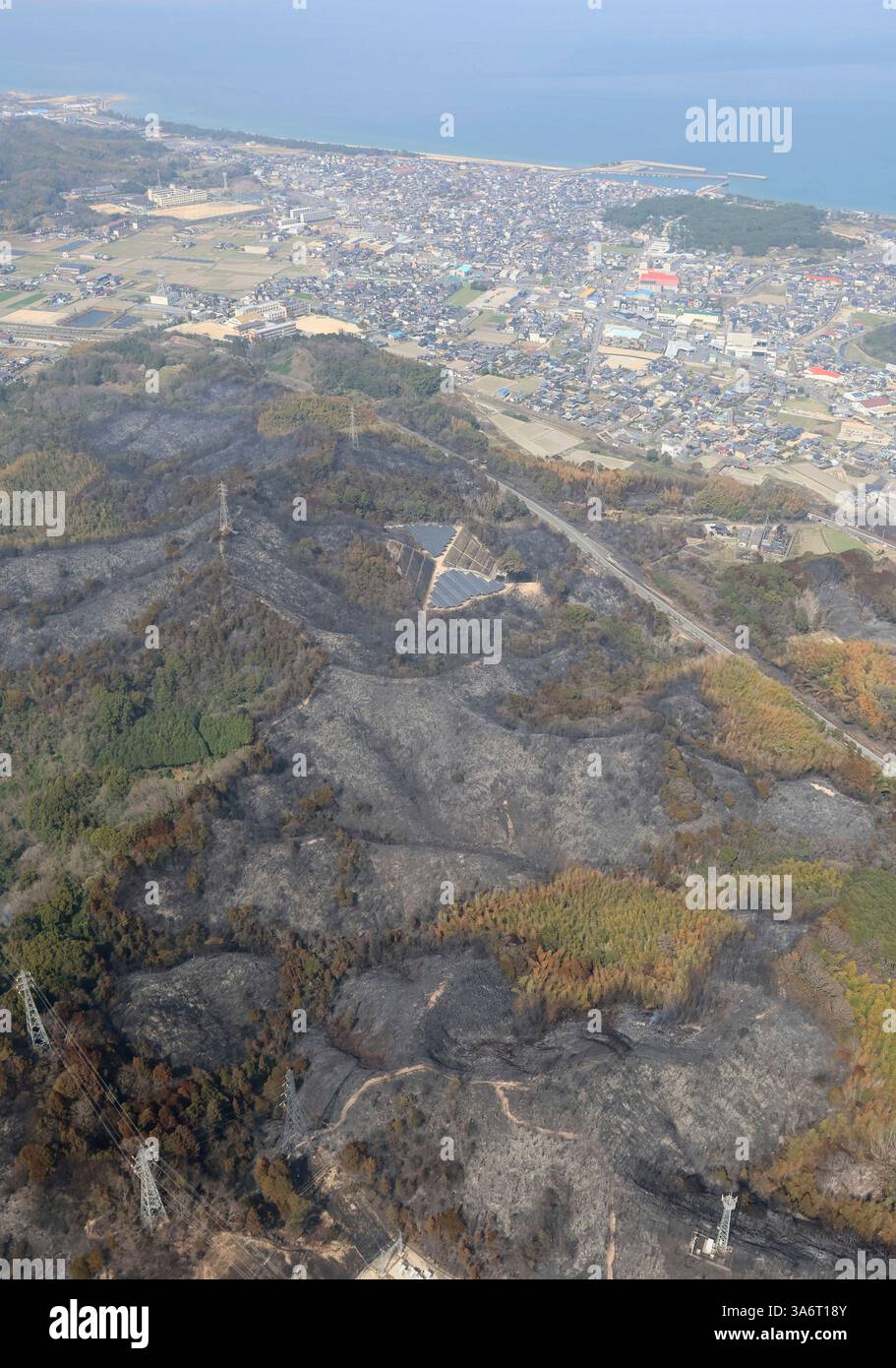 Aerial photo shows burnt mountain forest due to forest fire in Imabari ...