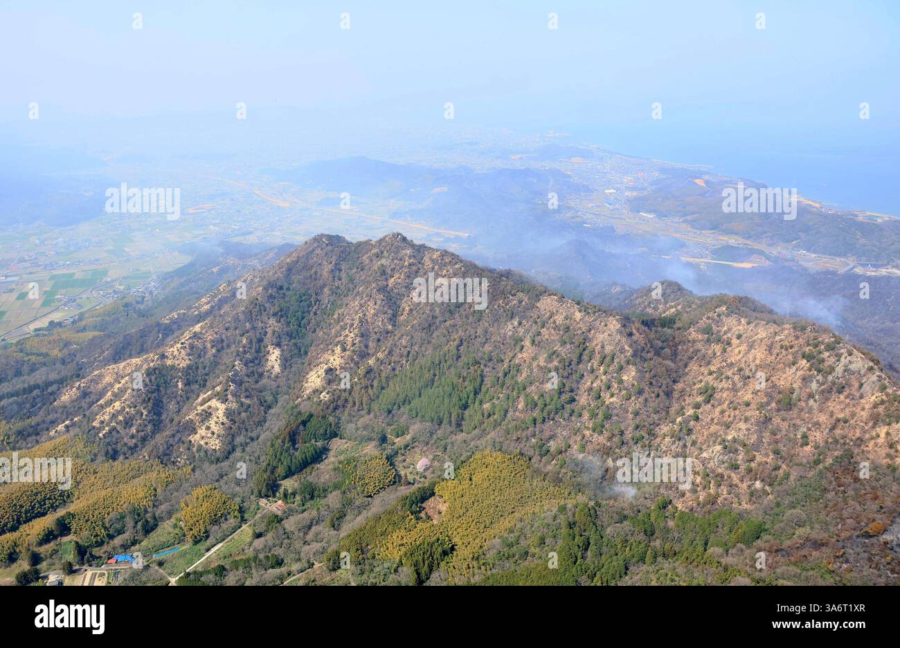 Aerial photo shows burnt mountain forest due to forest fire in Imabari ...