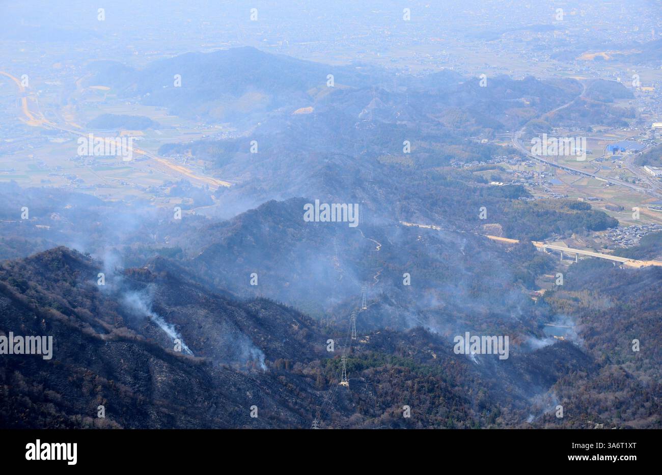 Aerial photo shows burnt mountain forest due to forest fire in Imabari ...