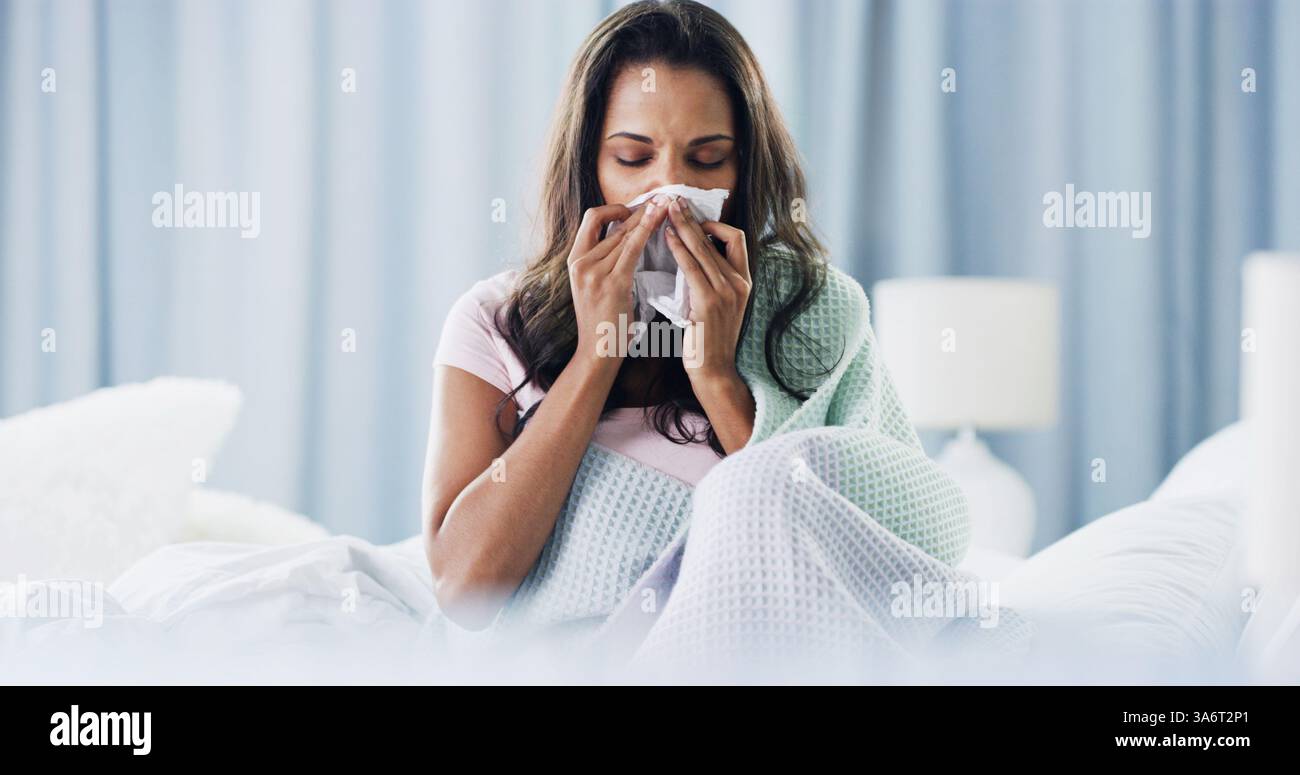 Woman, tissue and blowing nose in bed with flu, mucus or nasal ...