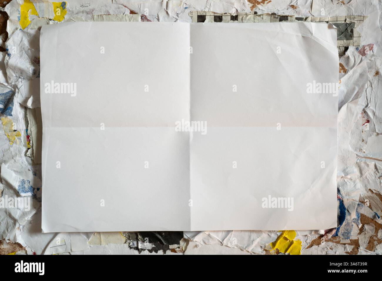 Folded rectangular paper on dirty wall Stock Photo - Alamy