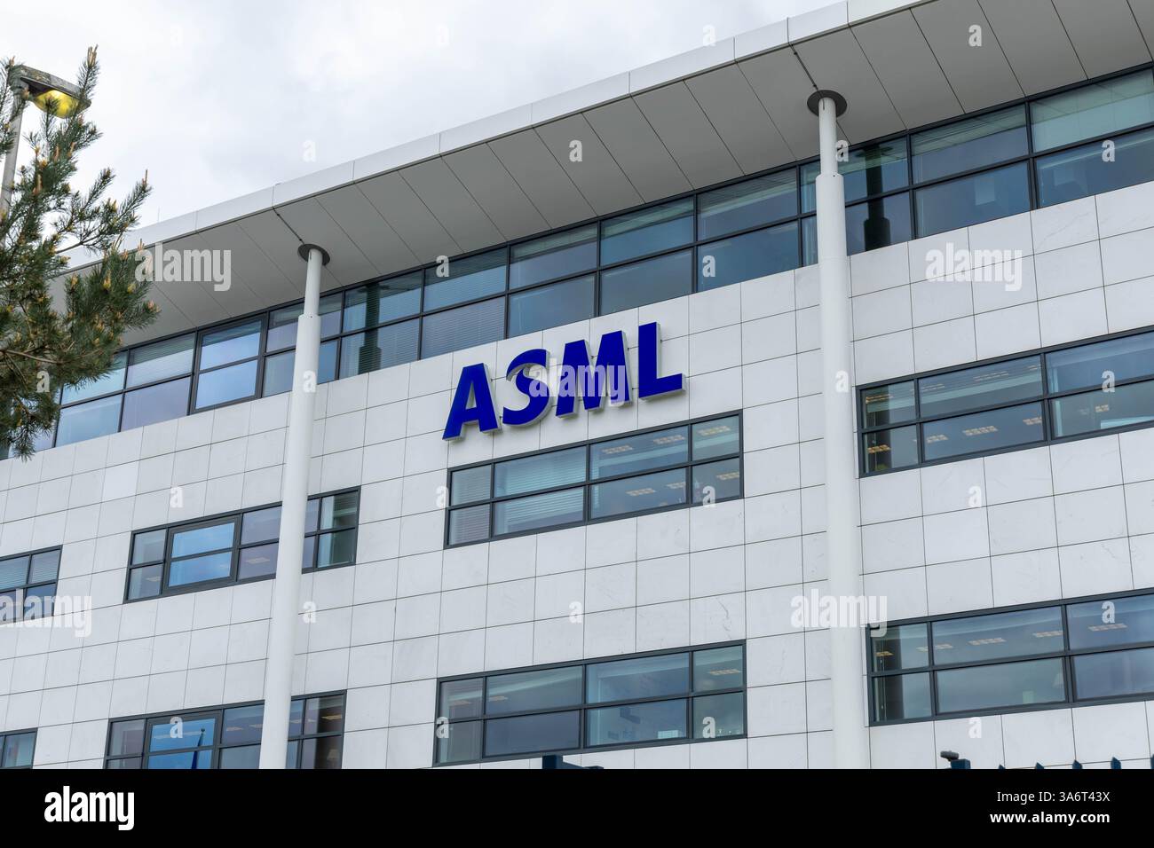 Veldhoven, the Netherlands. 18 April 2024. ASML company logo with its building and the exterior ...