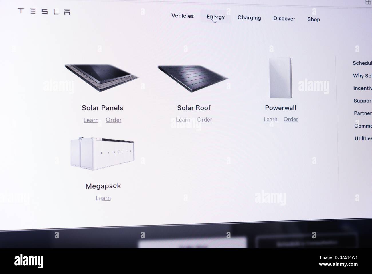 Tesla energy products display: solar panels, solar roof, powerwall ...