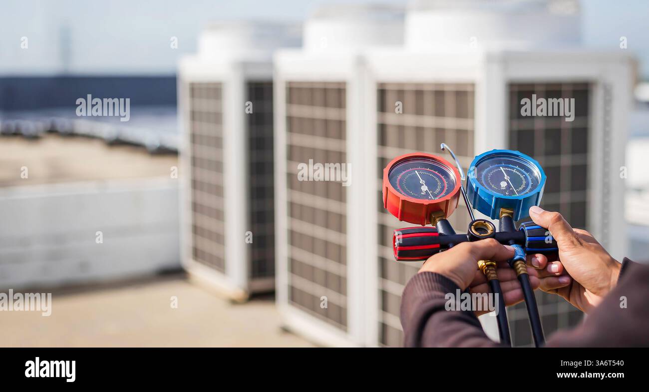 Air repair mechanic using measuring equipment for filling industrial ...