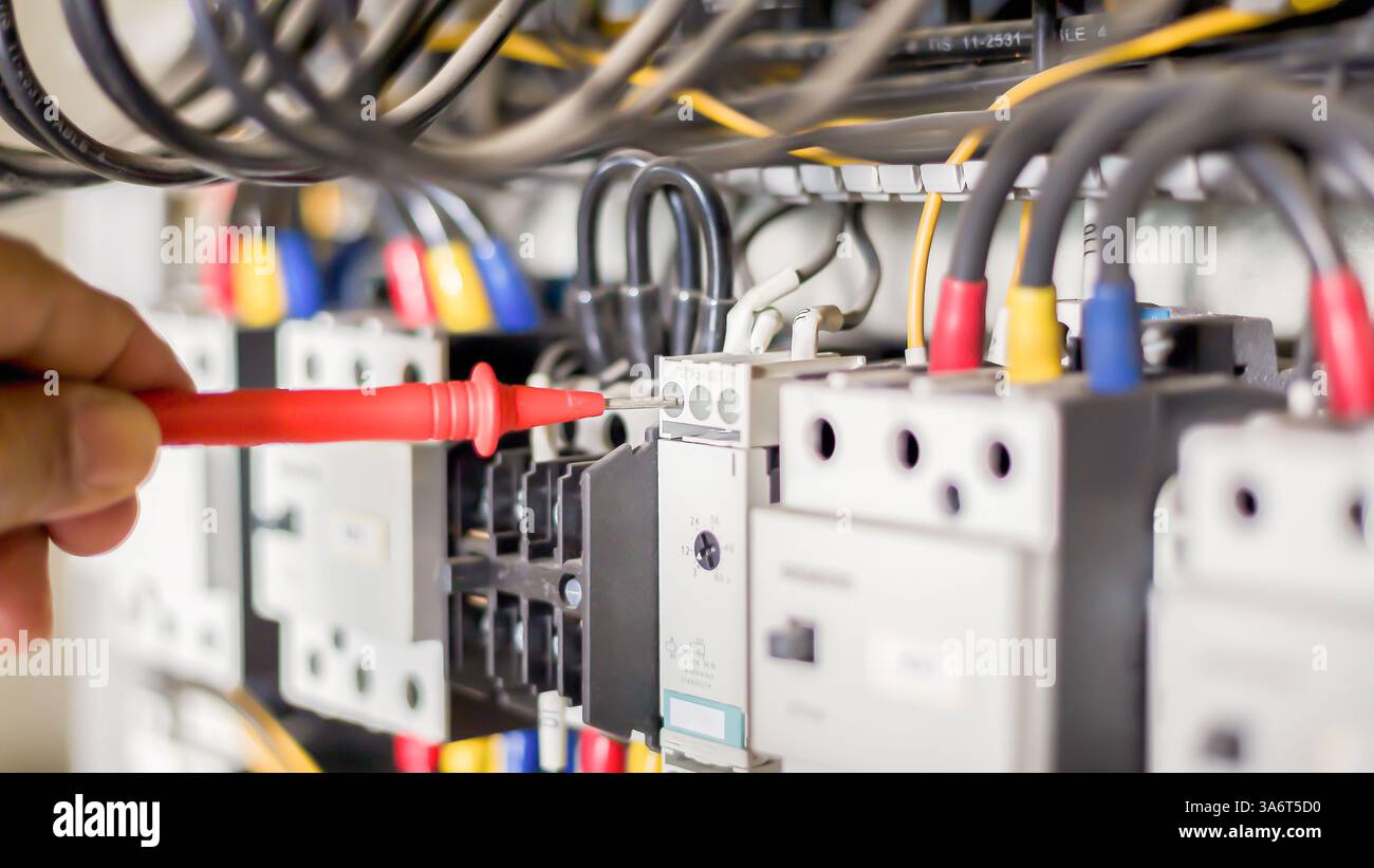 Electrician engineer work tester measuring voltage and current of power ...