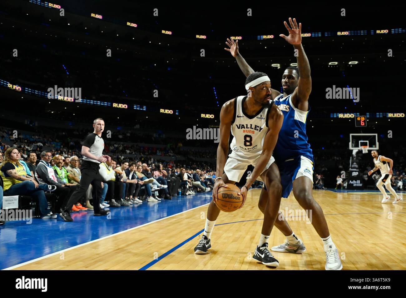 Suns Guard Paul Watson #8 is defended by Capitanes forward David Jones ...