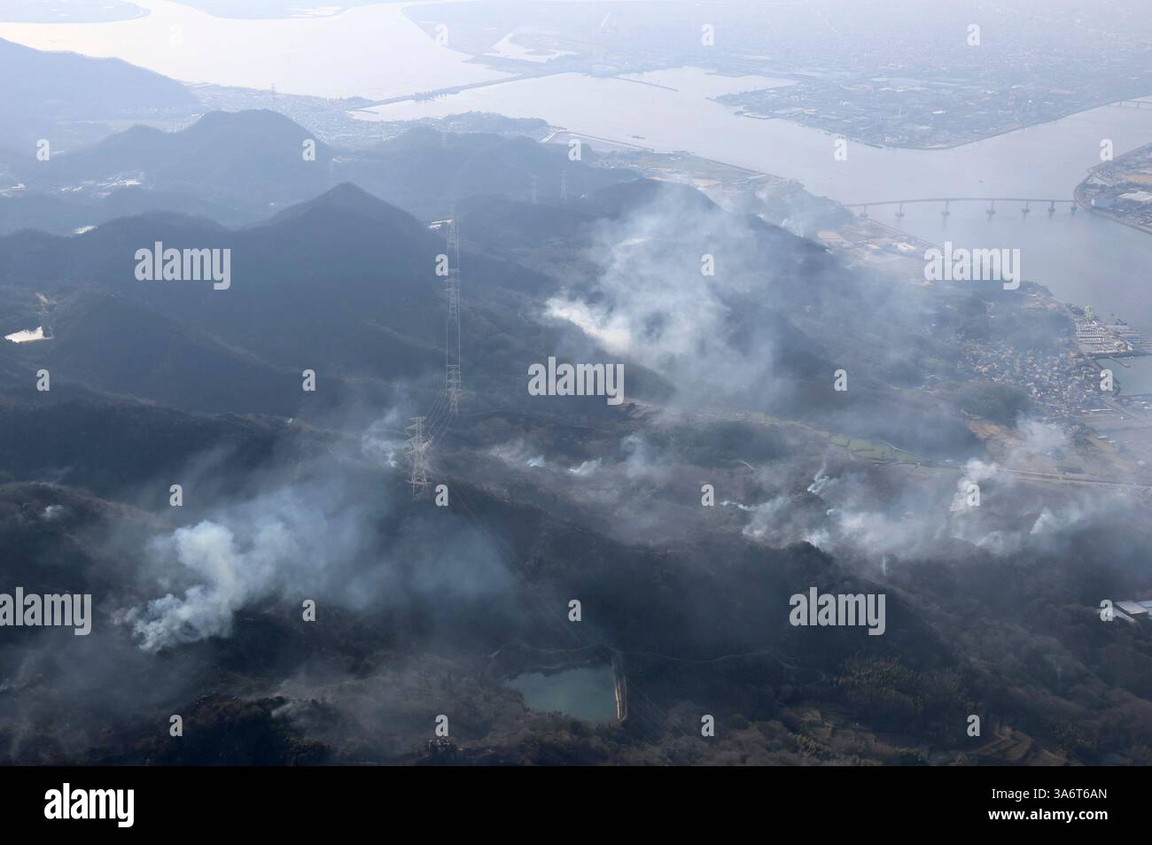Aerial photo shows burnt mountains due to forest fire in Imabari City ...
