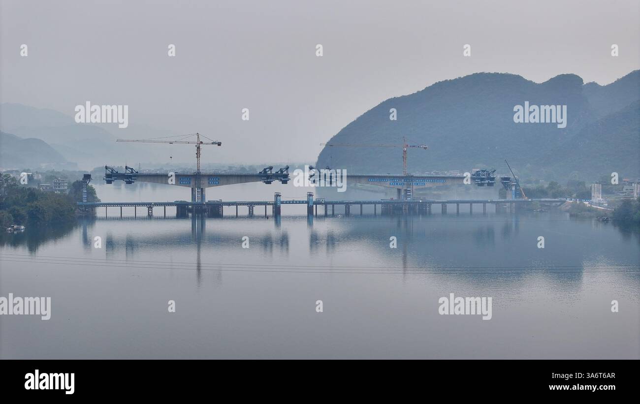 Workers are working at the construction site of Rongjiang Large Bridge ...