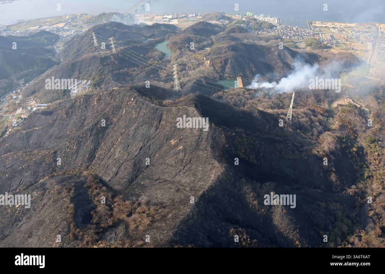 Aerial photo shows burnt mountains due to forest fire in Imabari City ...
