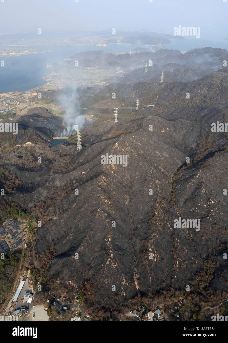 Aerial photo shows burnt mountains due to forest fire in Imabari City ...