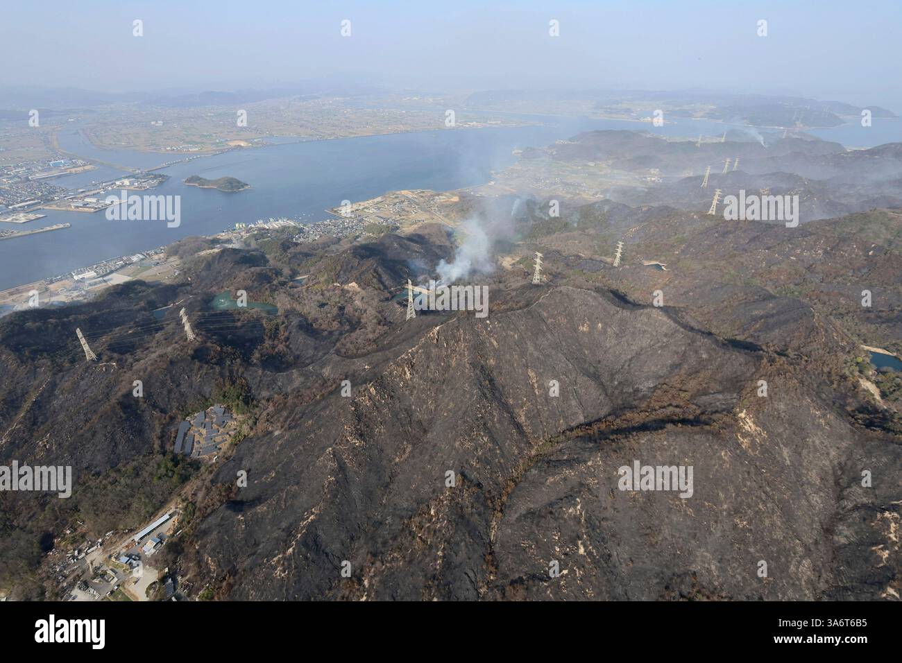 Aerial photo shows burnt mountains due to forest fire in Imabari City ...