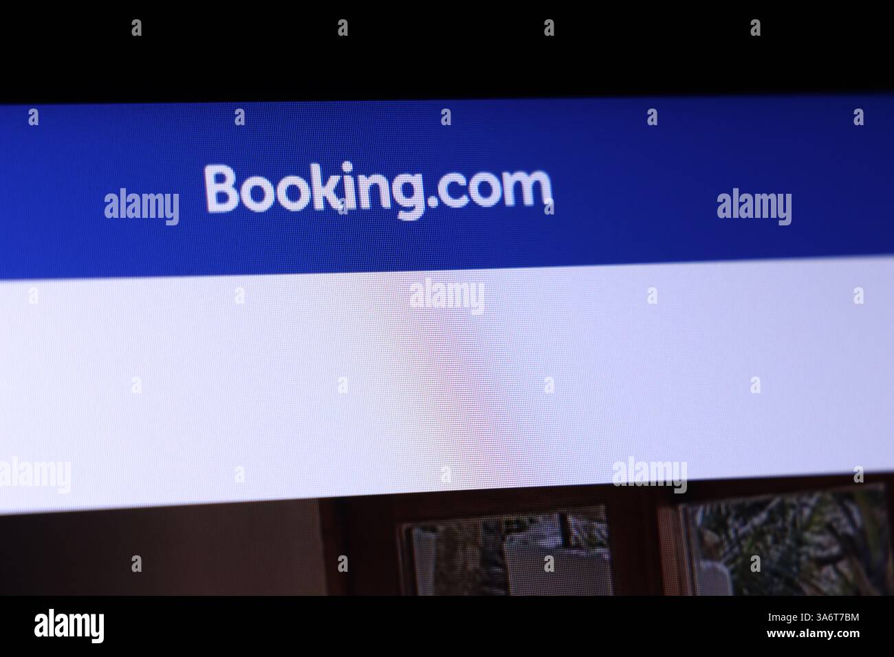Booking.com website interface on monitor screen displaying travel ...