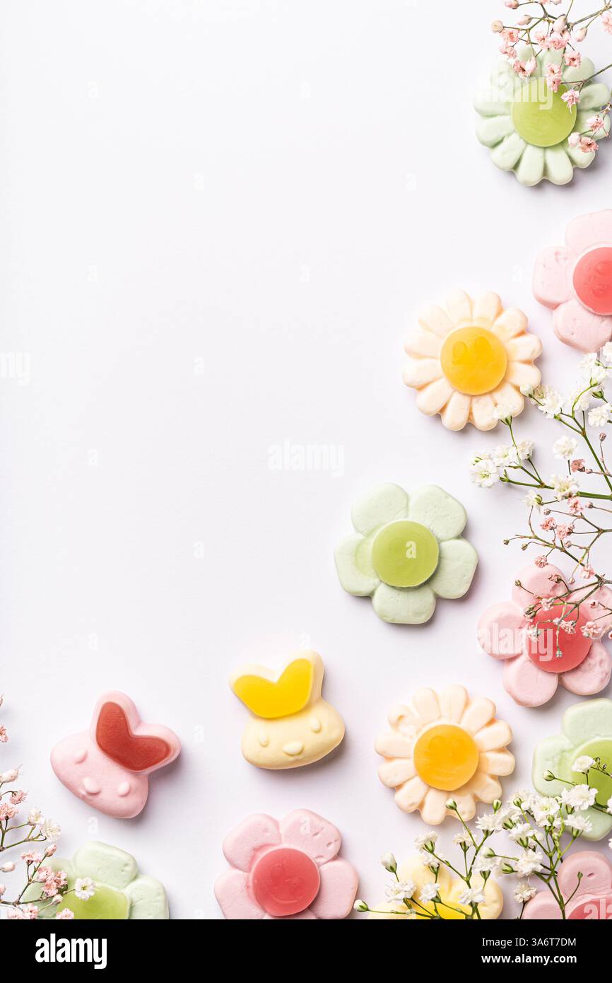 Colorful flower-shaped candies on white background Stock Photo - Alamy