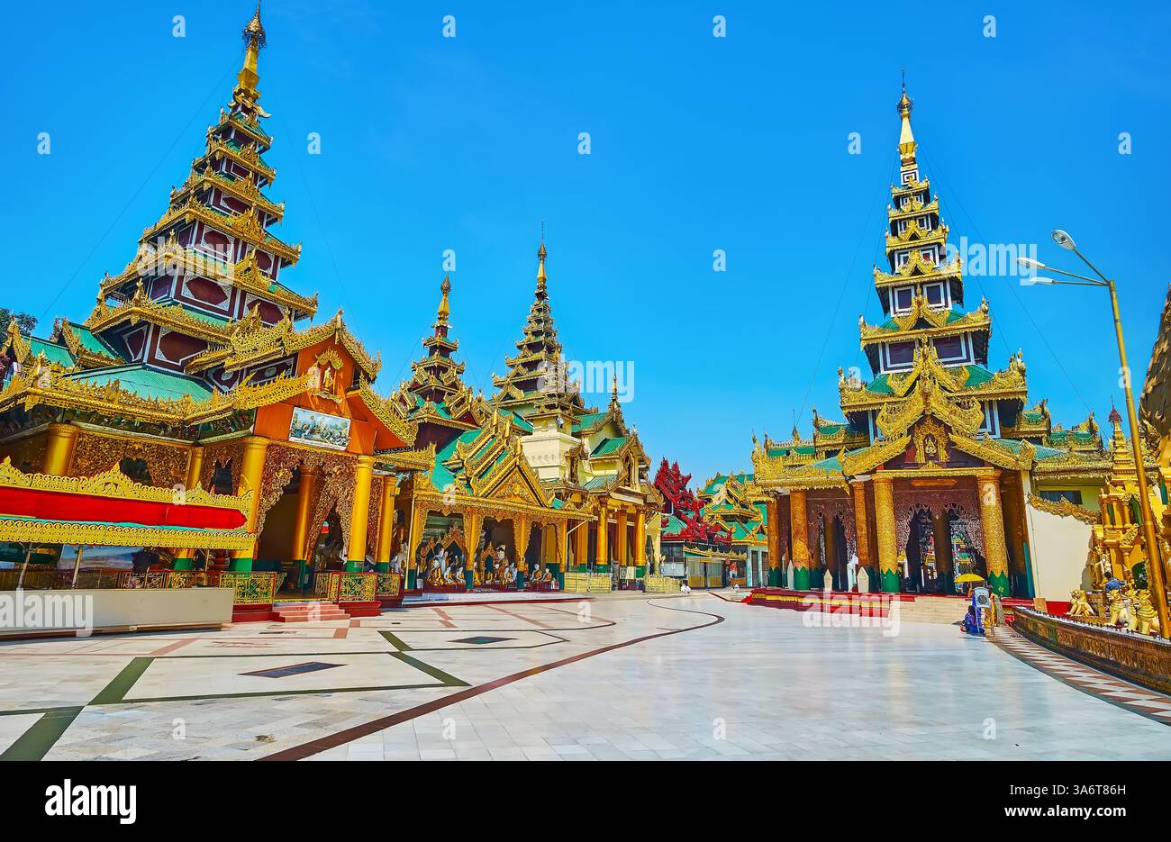 The Western alley of Shwedagon Pagoda stretches between Rakhine Tazaung ...