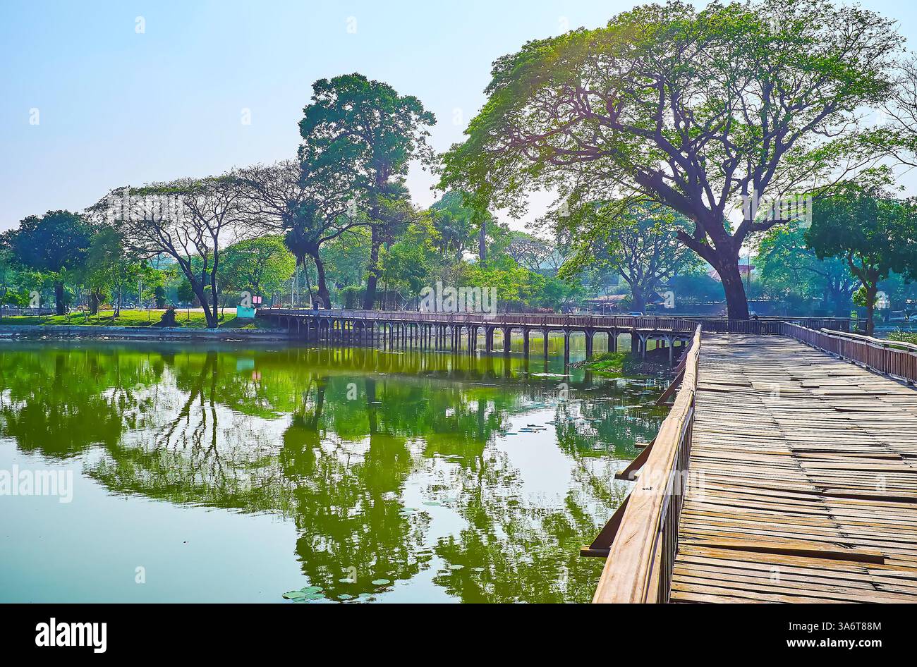 The wobbly creaking timber bridge across the lake is the local ...