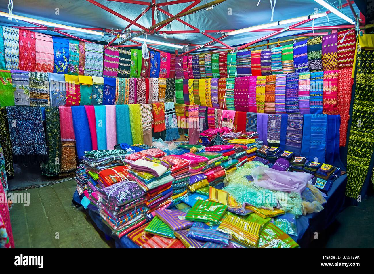 The garment stall with wide range of traditional Burmese longyi (dress, skirt), located in Gyar ...