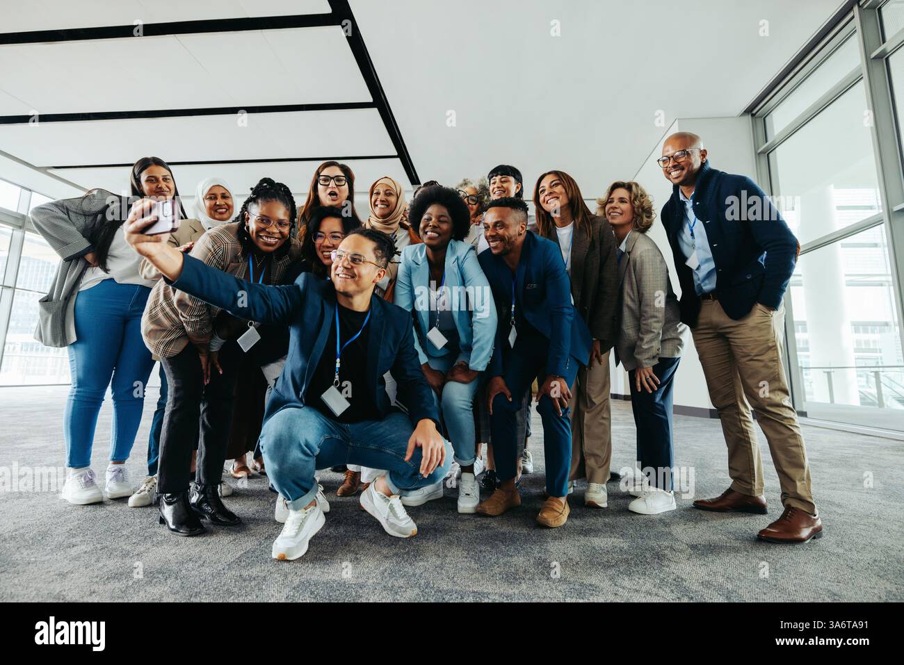 Corporate team group photo in a modern office, showing diversity and ...