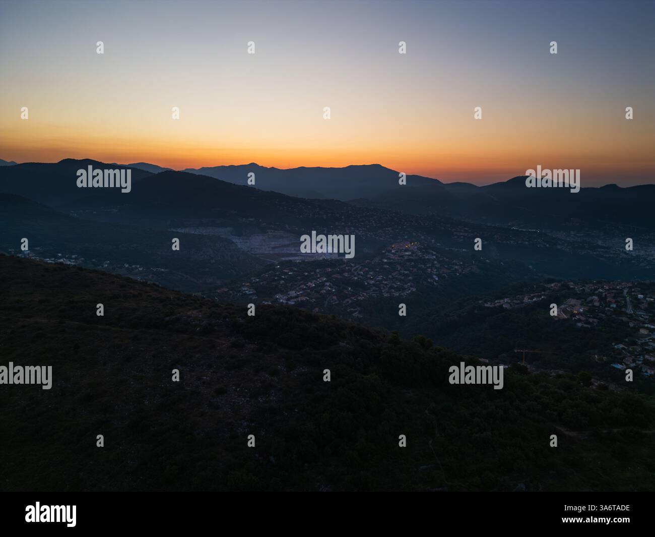 Pre-dawn aerial view of Nice, France, showcasing the foothills of the ...