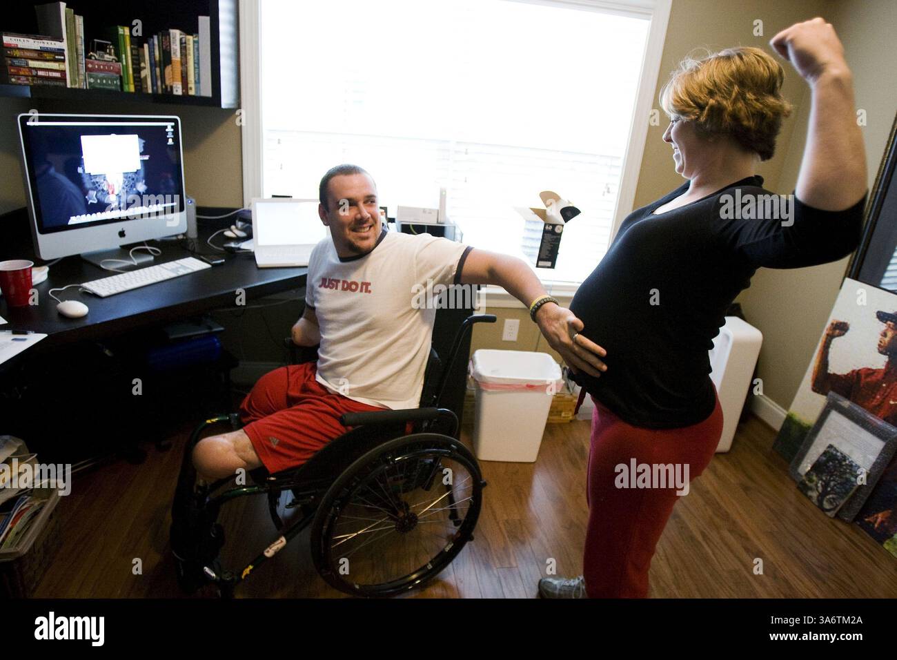 Nov. 5, 2008 - Joey Bozik, left, feels his wife Jayme's stomach as he ...