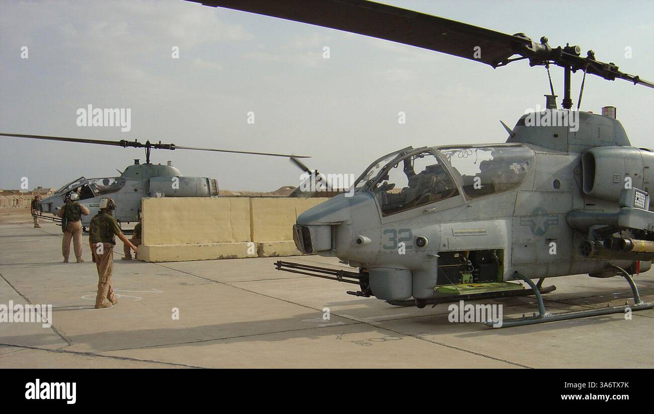 Nov 11, 2004; Al Taqaddum, Iraq; Marines and AH-1W Super Cobras with ...