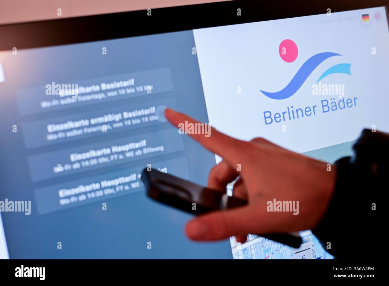 Berlin, Germany. 26th Mar, 2025. A man buys a one-way ticket from a ...