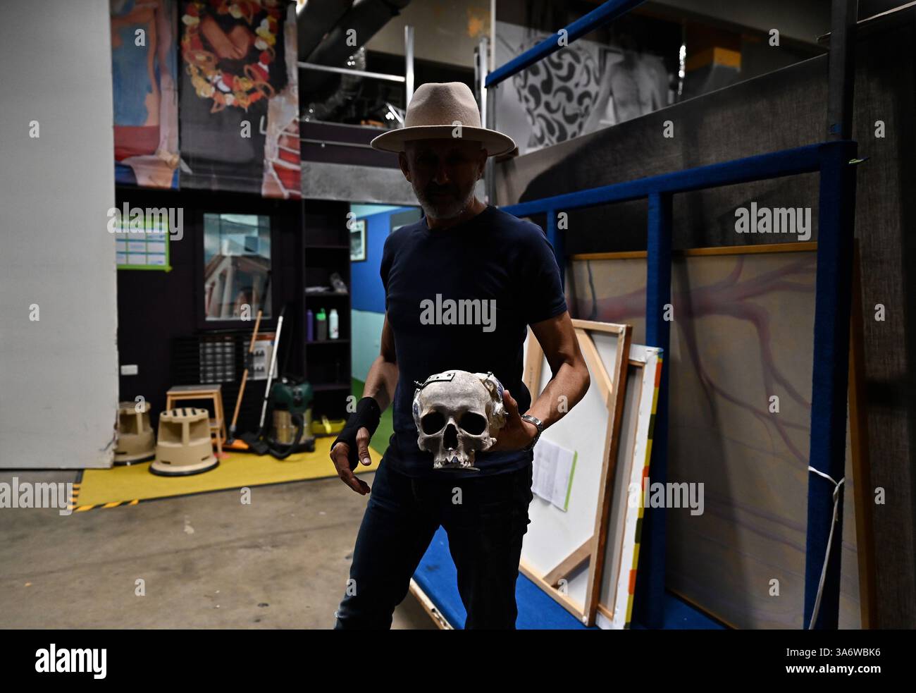 Artist Ravi Chand poses for a photograph as artists drop off entries ...