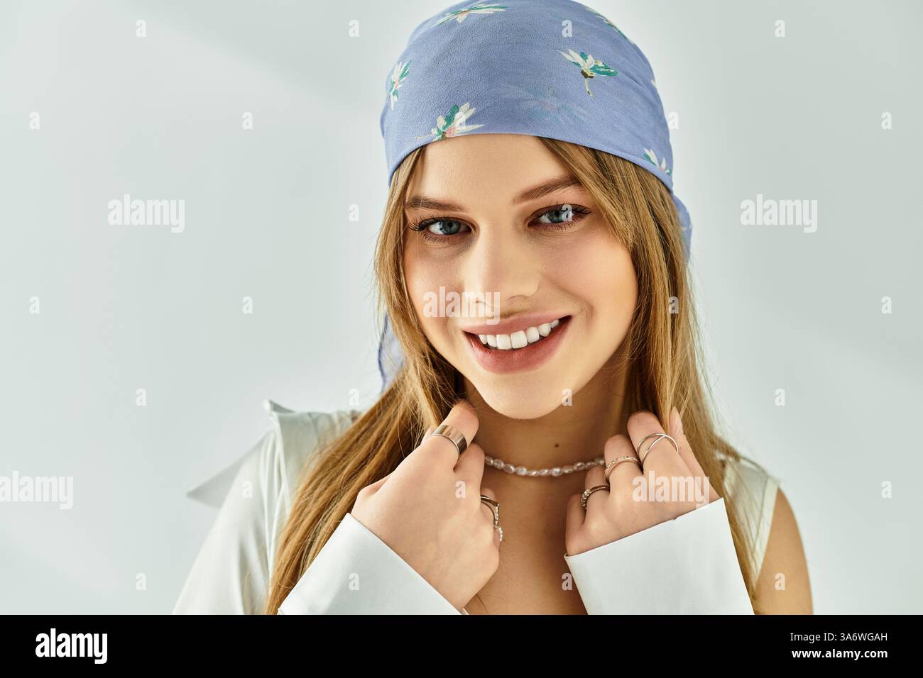 A stylish young woman captures spring in a trendy outfit with delicate ...