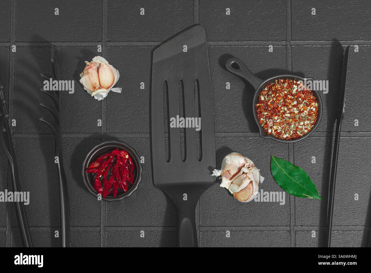 Barbecue season concept. Grill tongs, spatula, spices set, coarse salt ...