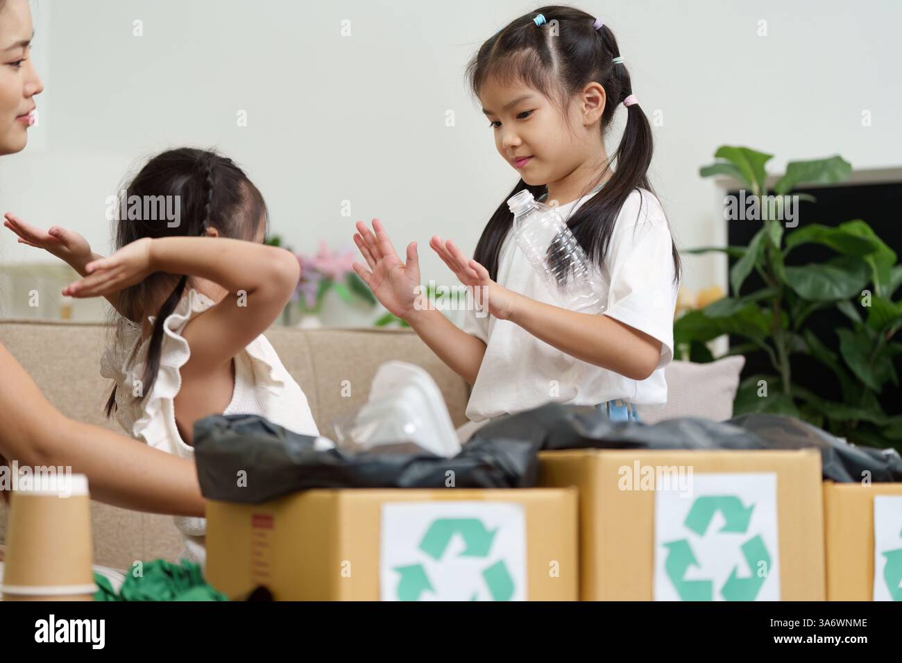 Eco-friendly Practices and Fun. Children learning about recycling ...