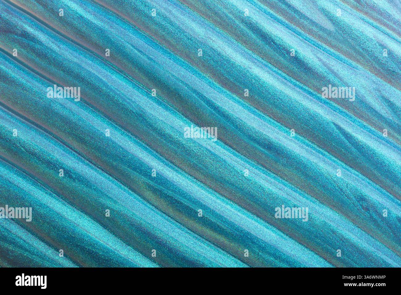Abstract shimmering turquoise texture with glittering waves and ...