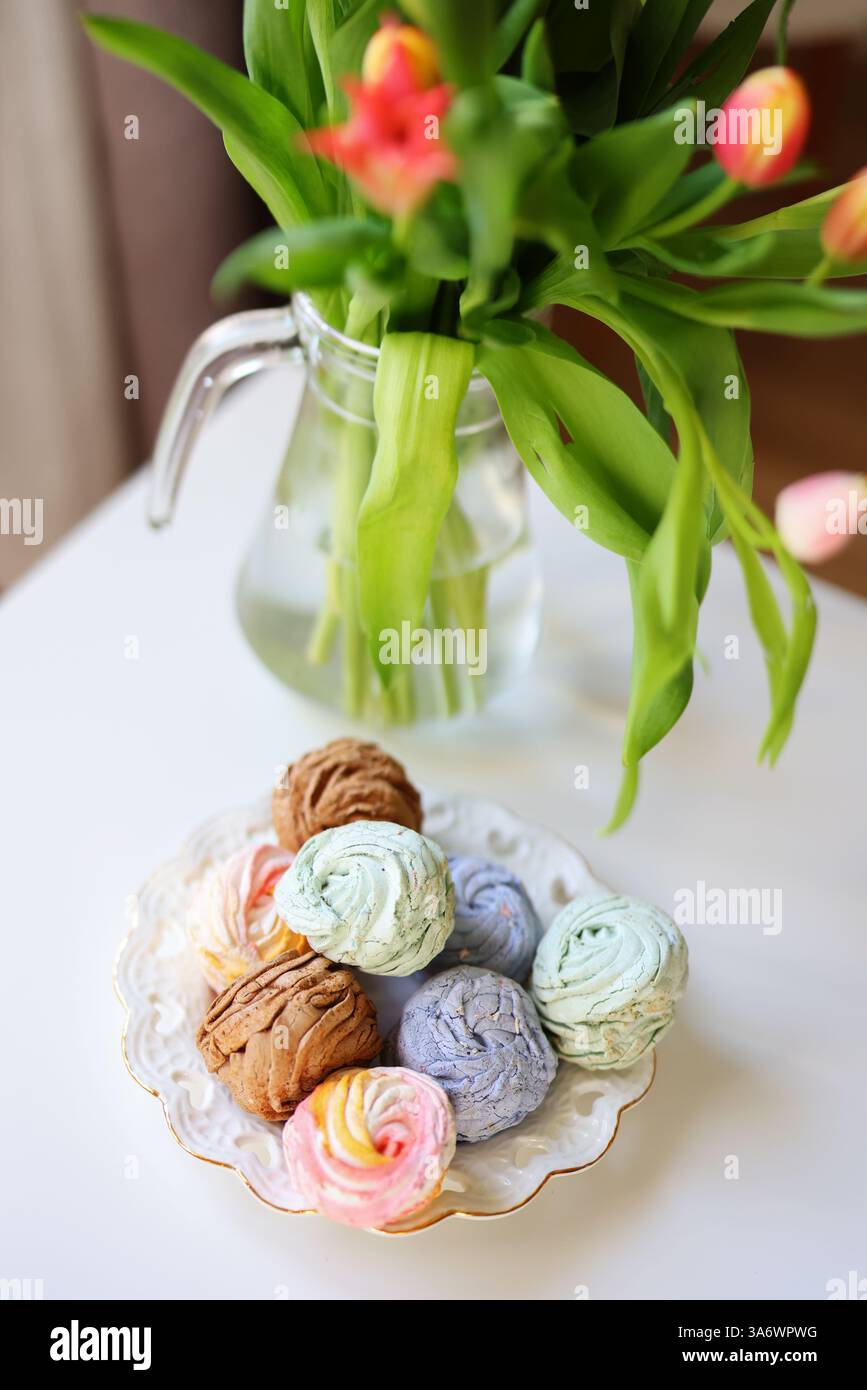 Assorted handmade chocolate candies on a vintage white plate with heart ...