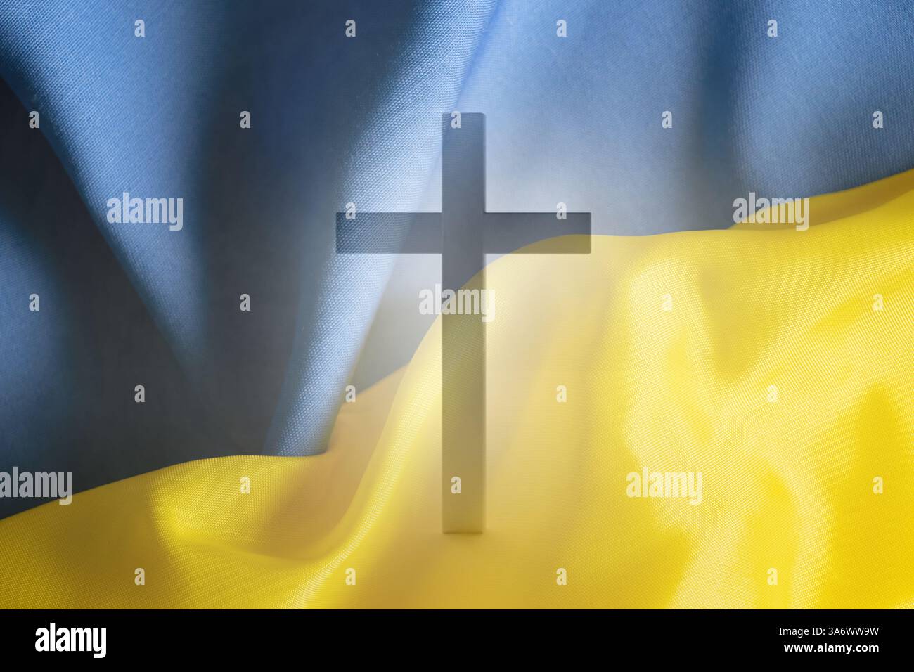 Cross against the background of the Ukrainian flag, memory and grief ...
