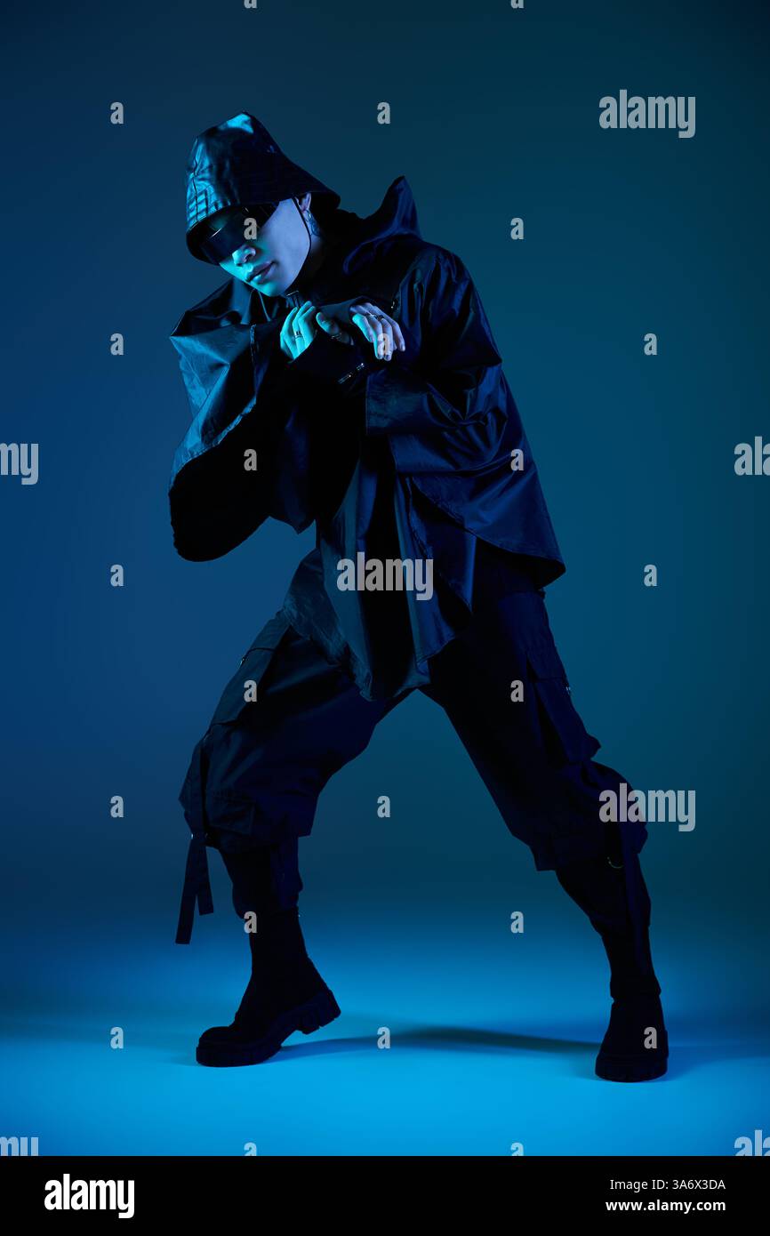 Handsome asian man strikes a dynamic pose in an eye catching outfit ...