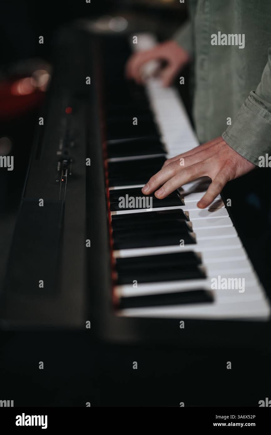 Musician Playing Electric Keyboard During Rehearsal in a Studio Stock ...