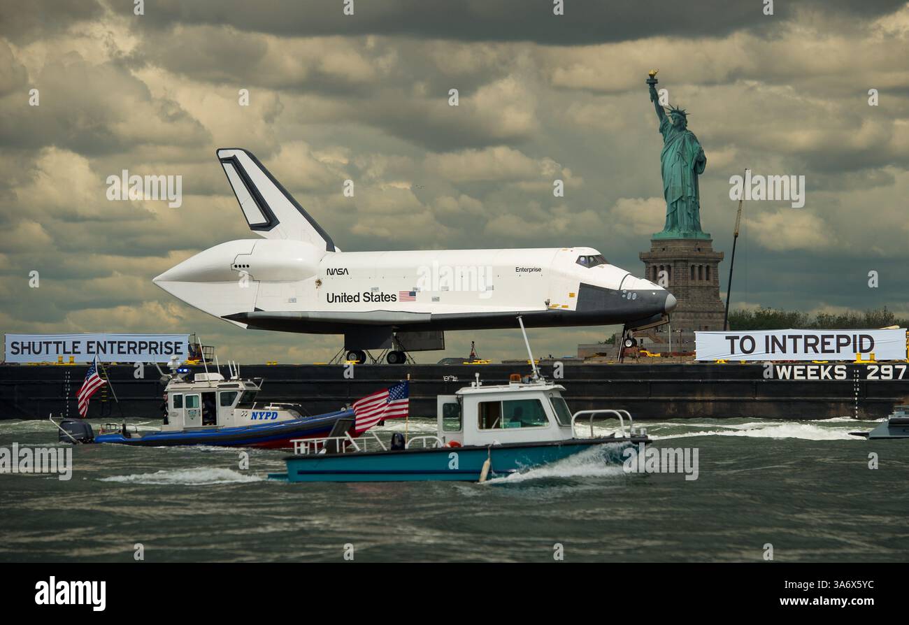June 6, 2012 - The space shuttle Enterprise, atop a barge, passes the ...