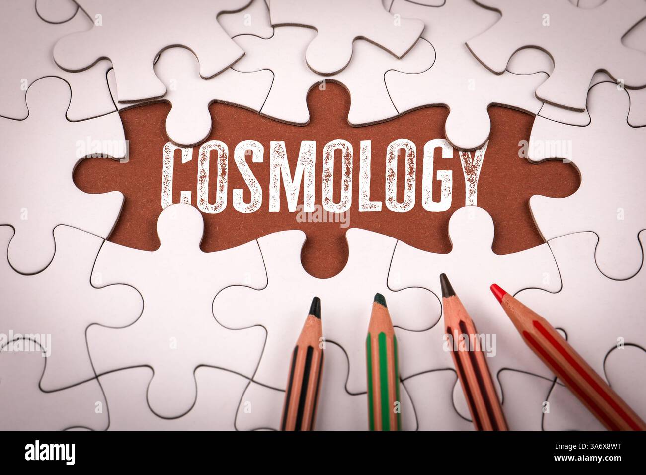 Cosmology. White puzzle pieces and colored pencils Stock Photo - Alamy