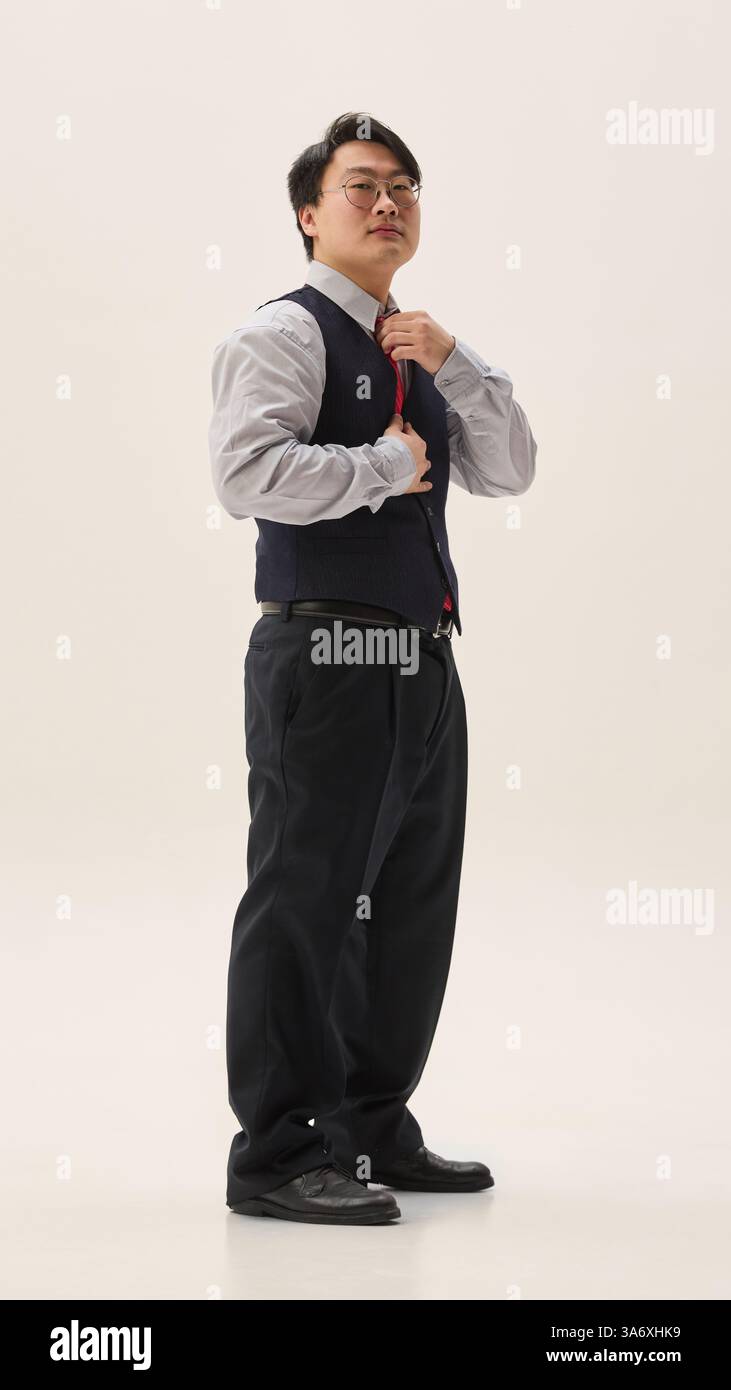 Full-length photo of attractive Asian man, dressed formal wear, looking ...