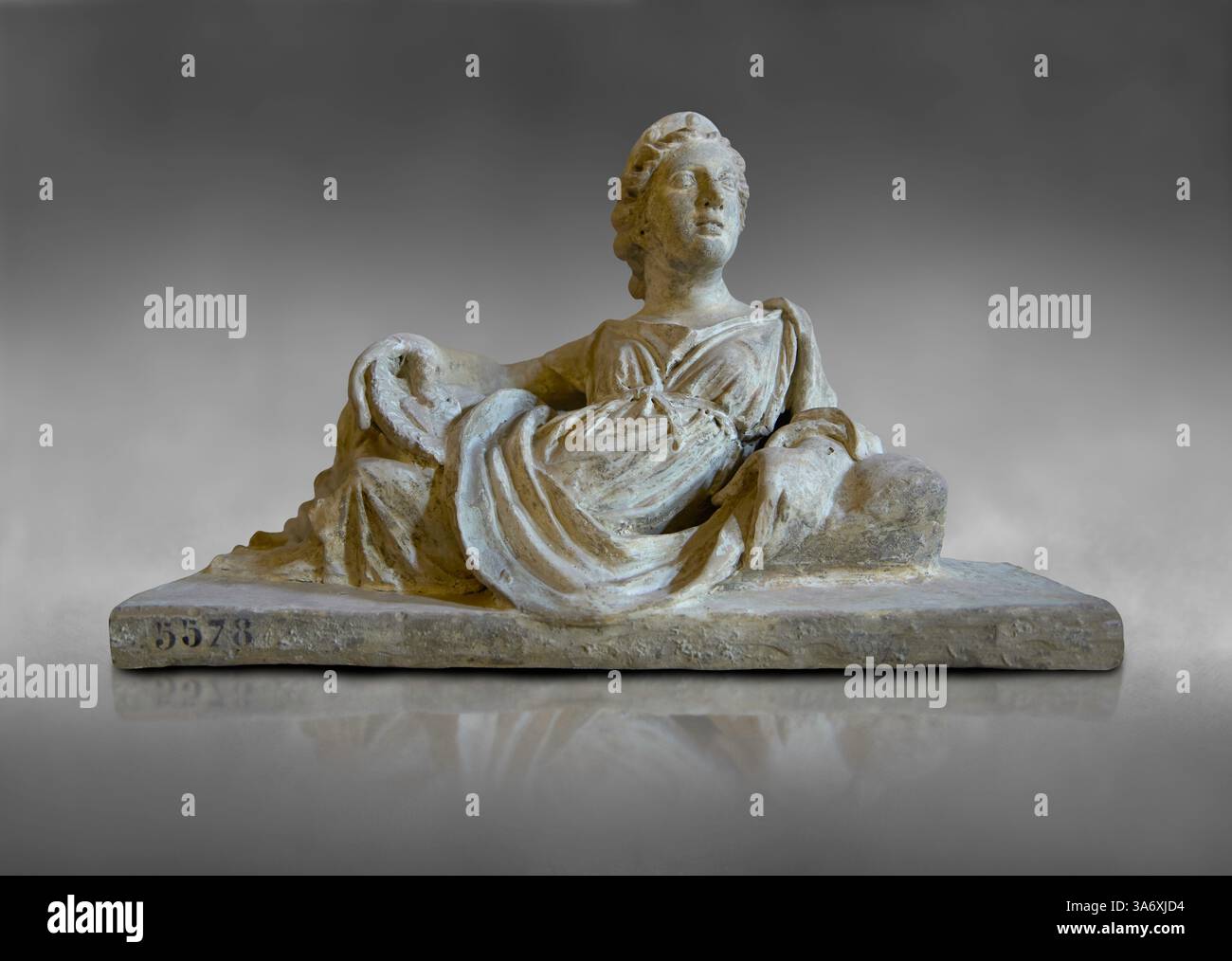 Reclining women on the lid of an Etruscan funerary cinerary urn ...