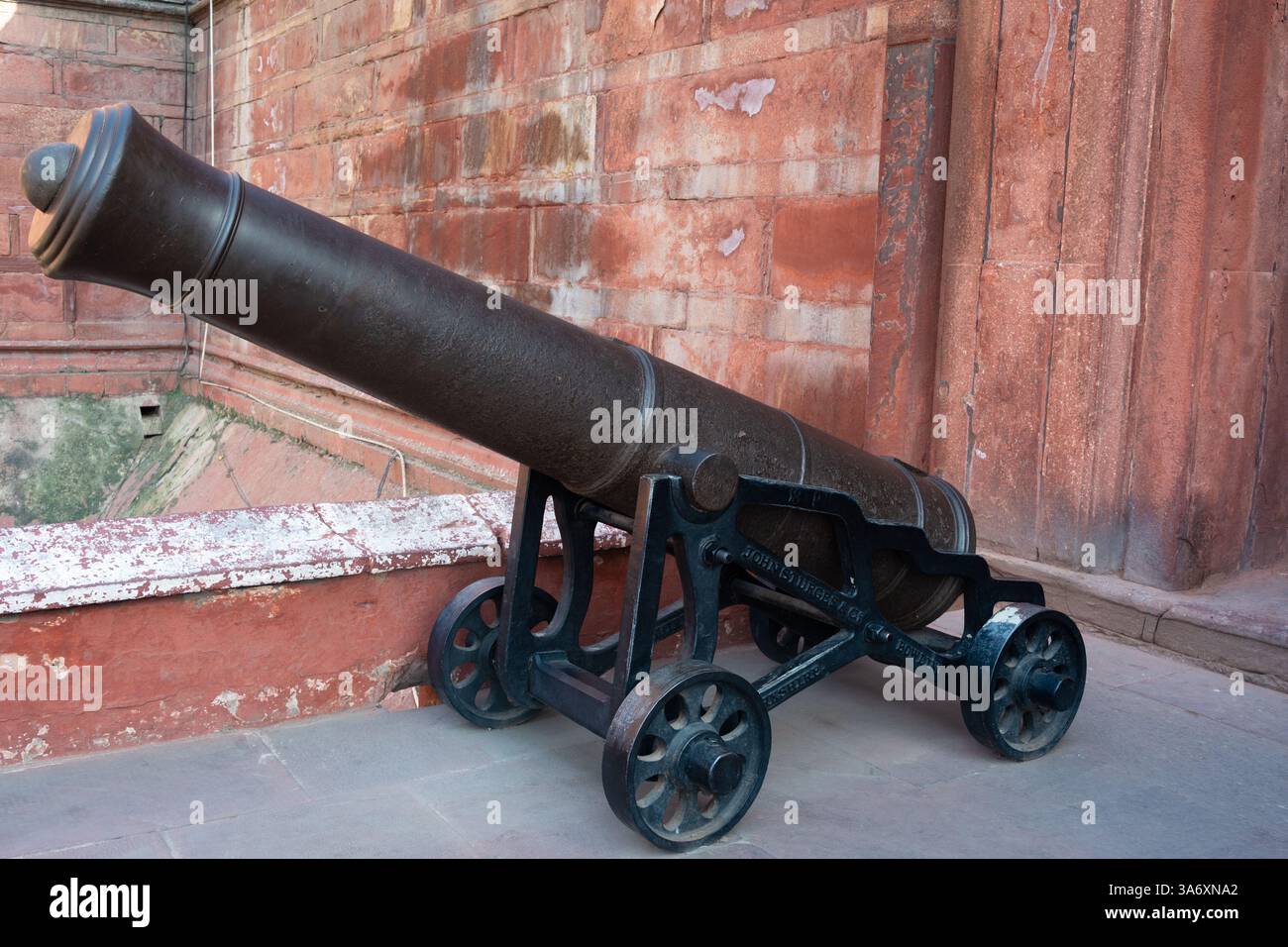 View of a cannon put on display at the entrance of the red fort gate ...