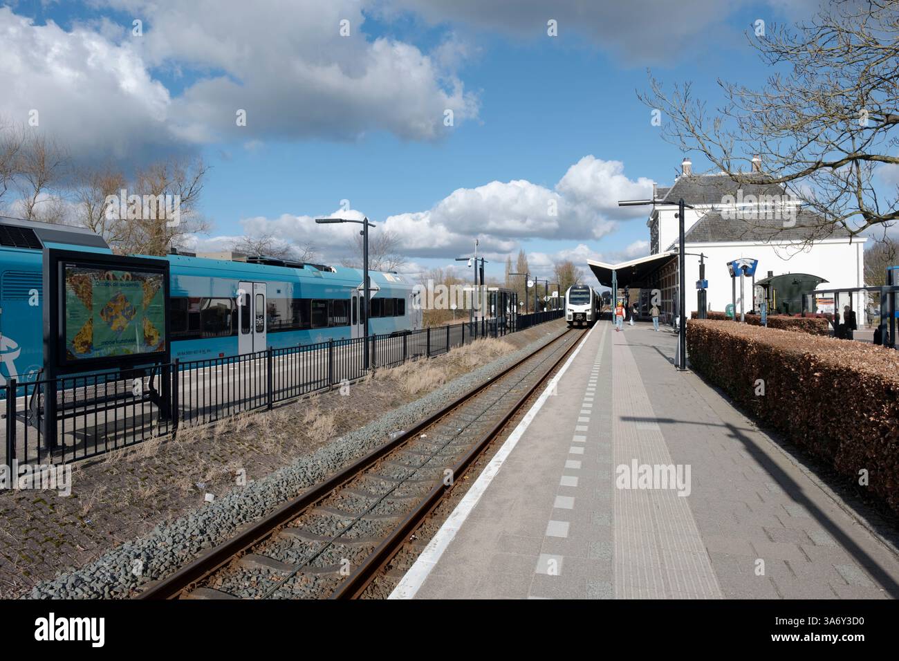 Platforms at Sneek train station with trains on the Leeuwarden ...