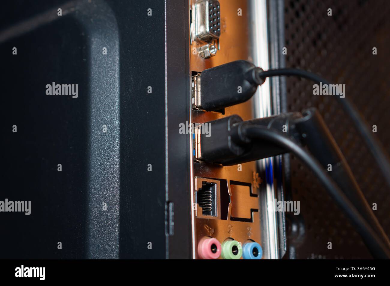Close-up of a computer's rear panel showing various ports including SUB ...