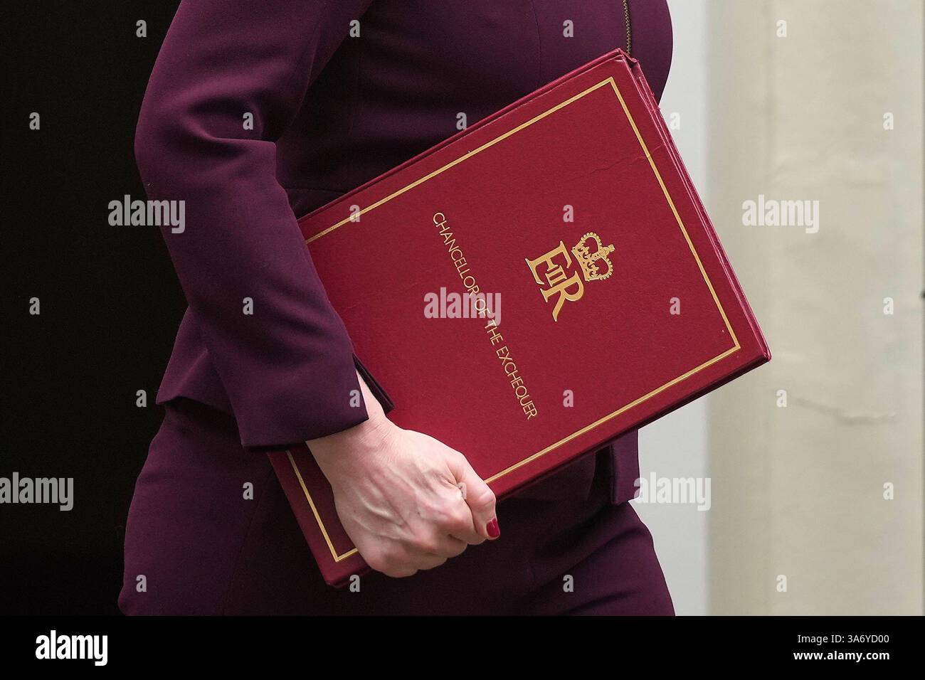 Britain's Chancellor of the Exchequer, Rachel Reeves, carries files as ...