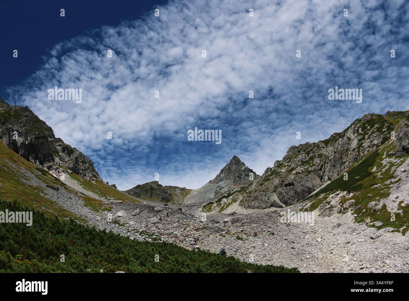 Mt.Yari seen from the Yarisawa hiking trail, with scaly clouds floating ...