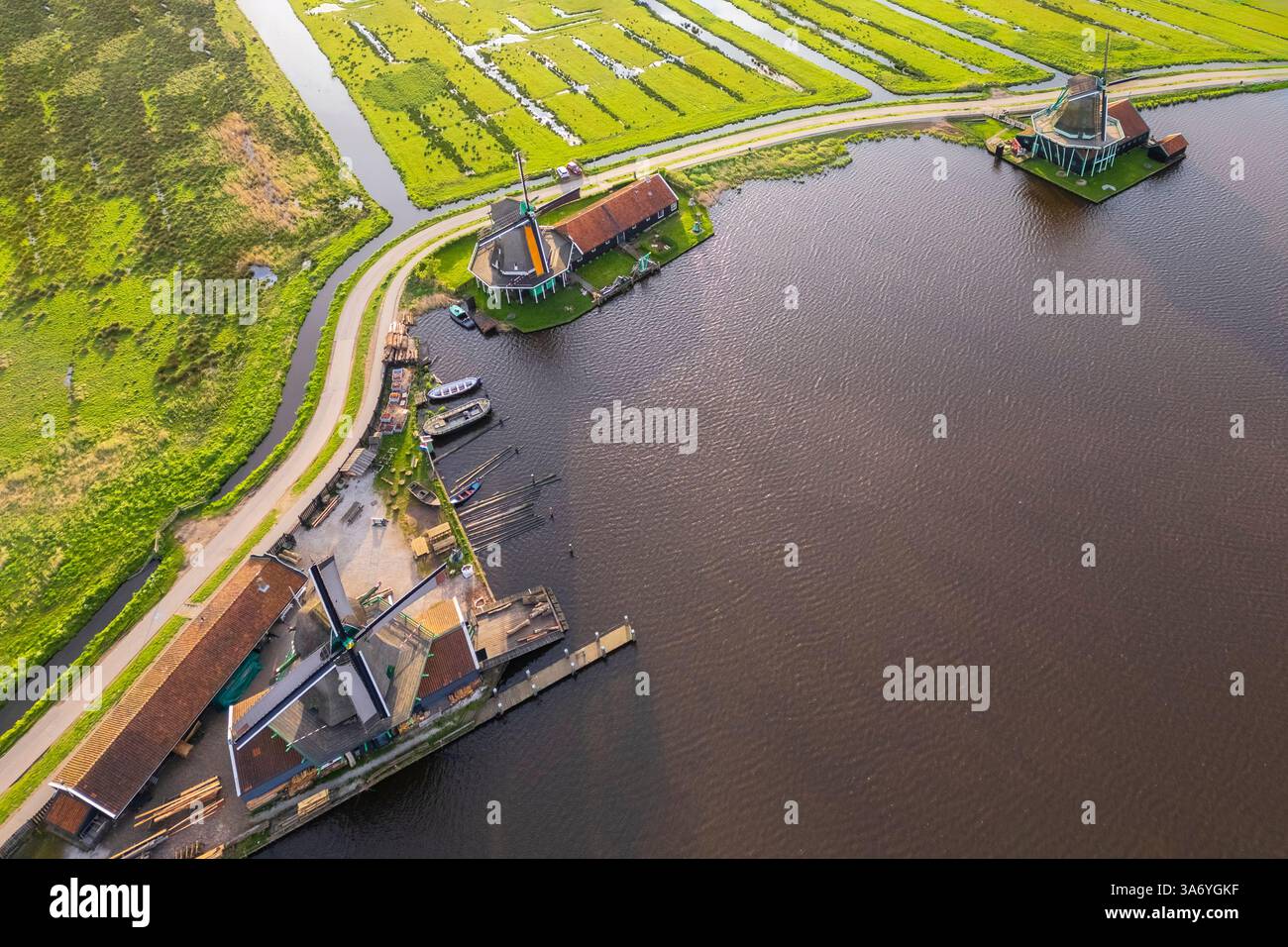 Aerial view of the typical windmills of Zaanse Schans on the river Zaan ...