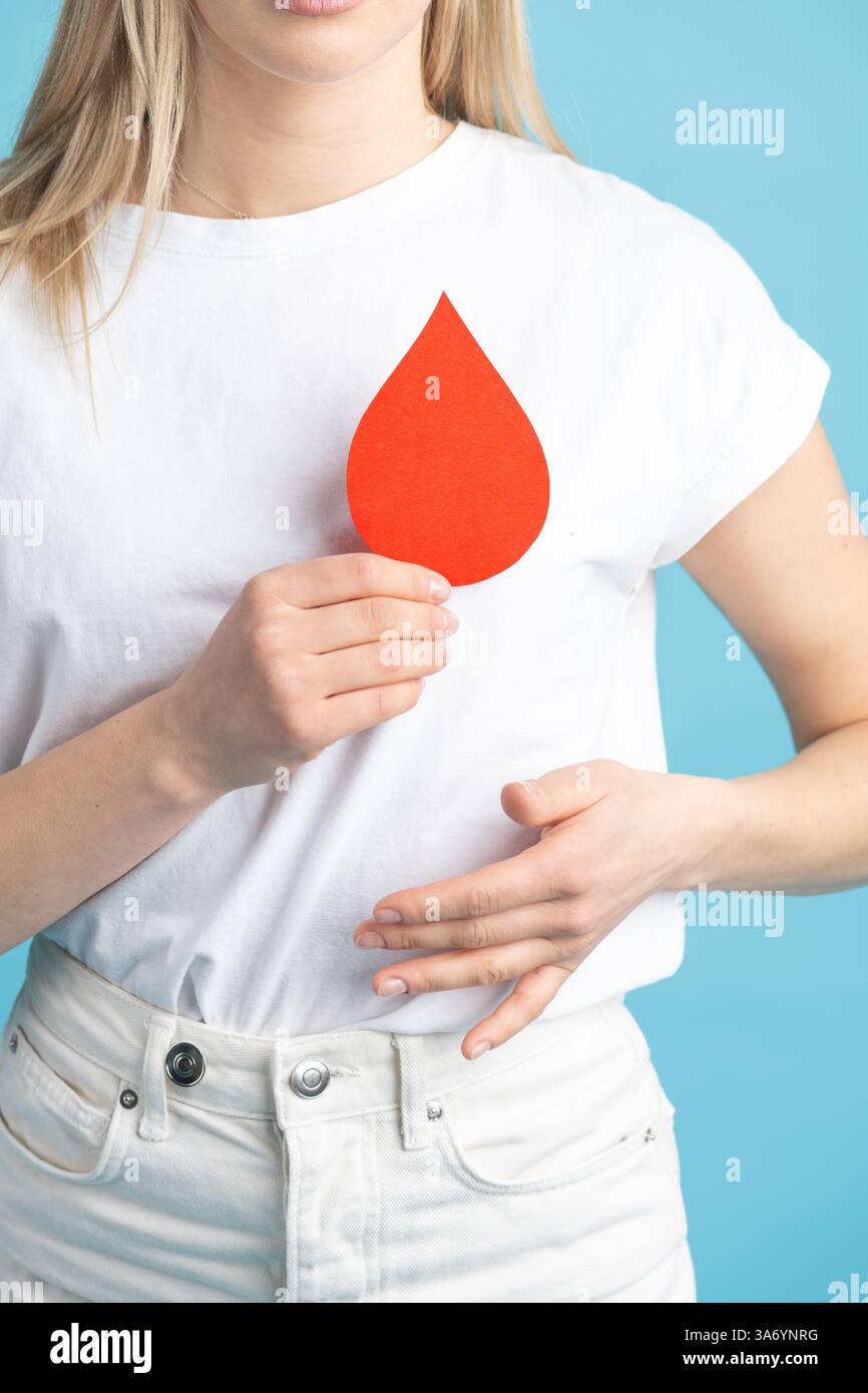 Blood donation, medicine and awareness concept. Beautiful woman holding ...