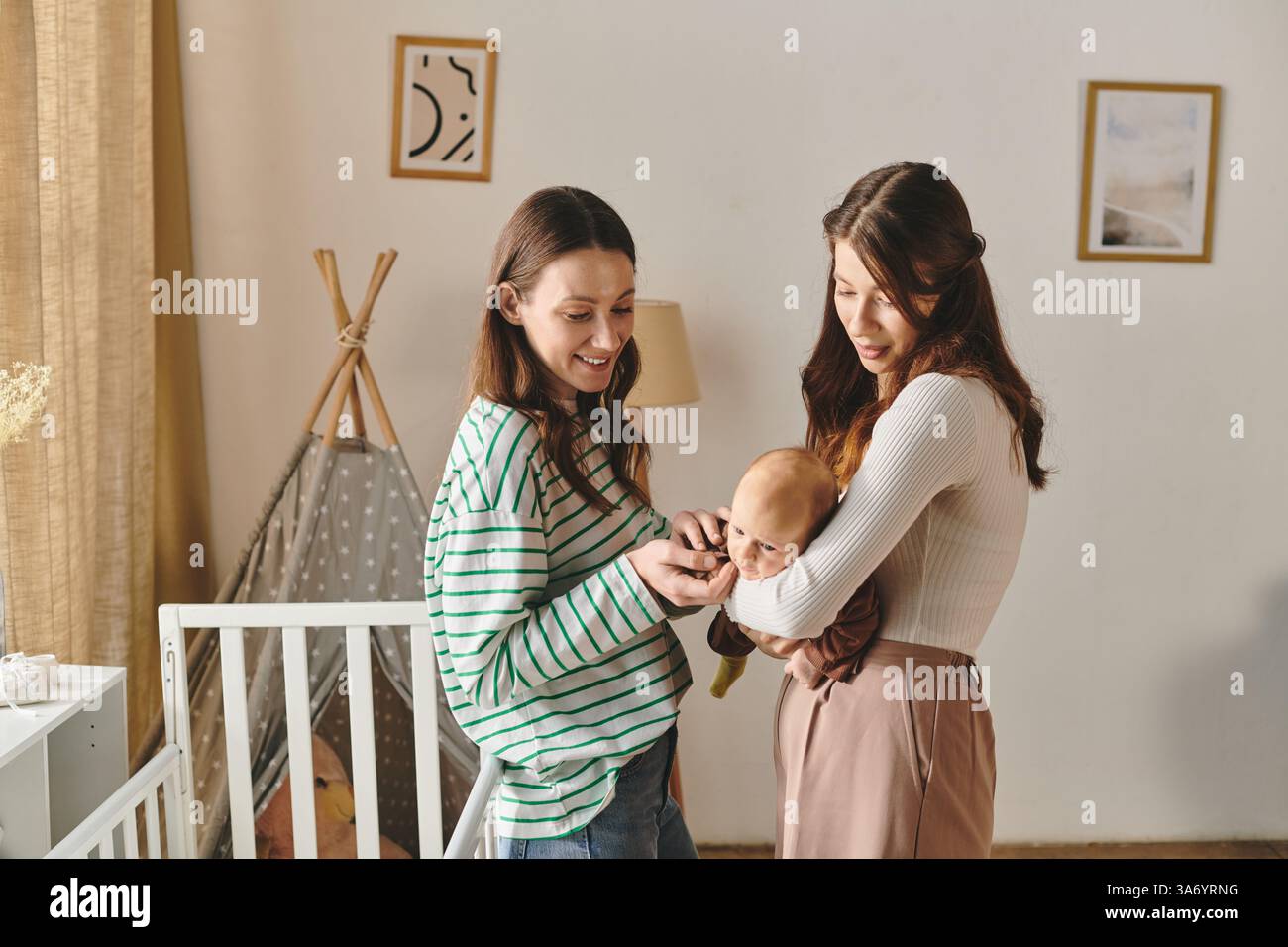 Two loving women share a heartfelt moment with their child, celebrating ...
