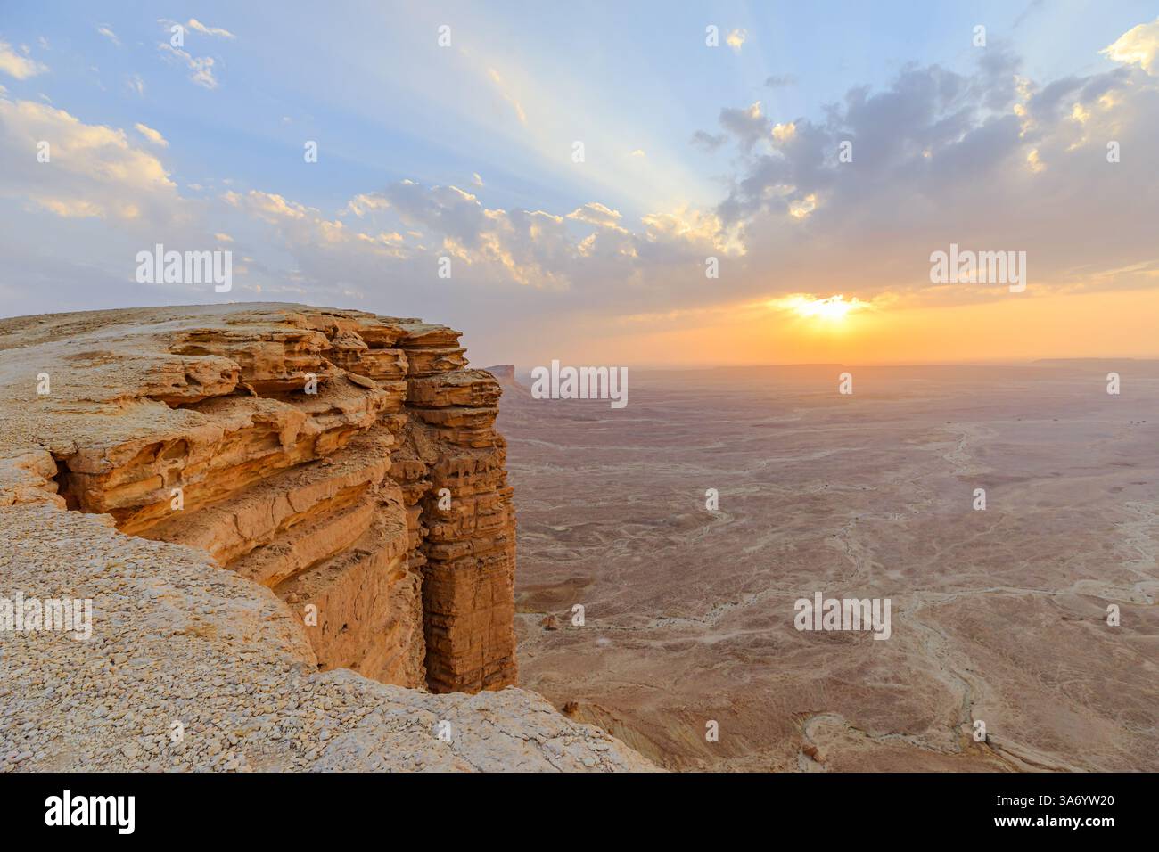 Golden hour sunlight illuminates the Tuwaiq escarpment at sunset ...